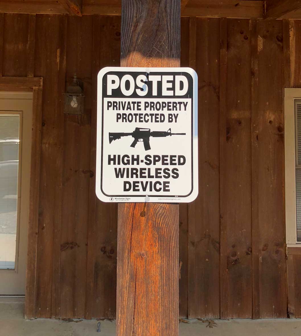 White Aluminum Private Property Protected by Gun – No Trespassing Signs
